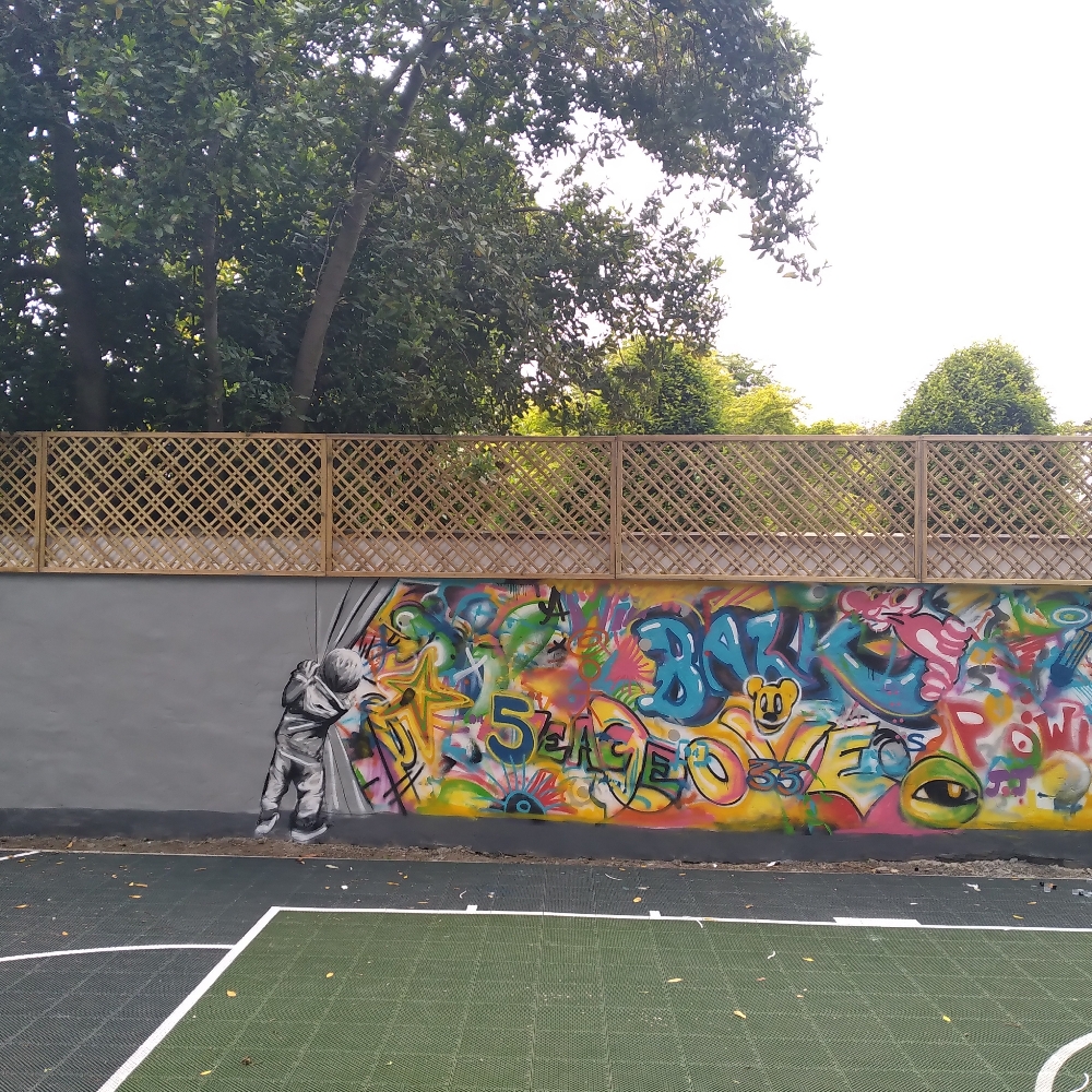 Outdoor basketball mural by Val in London