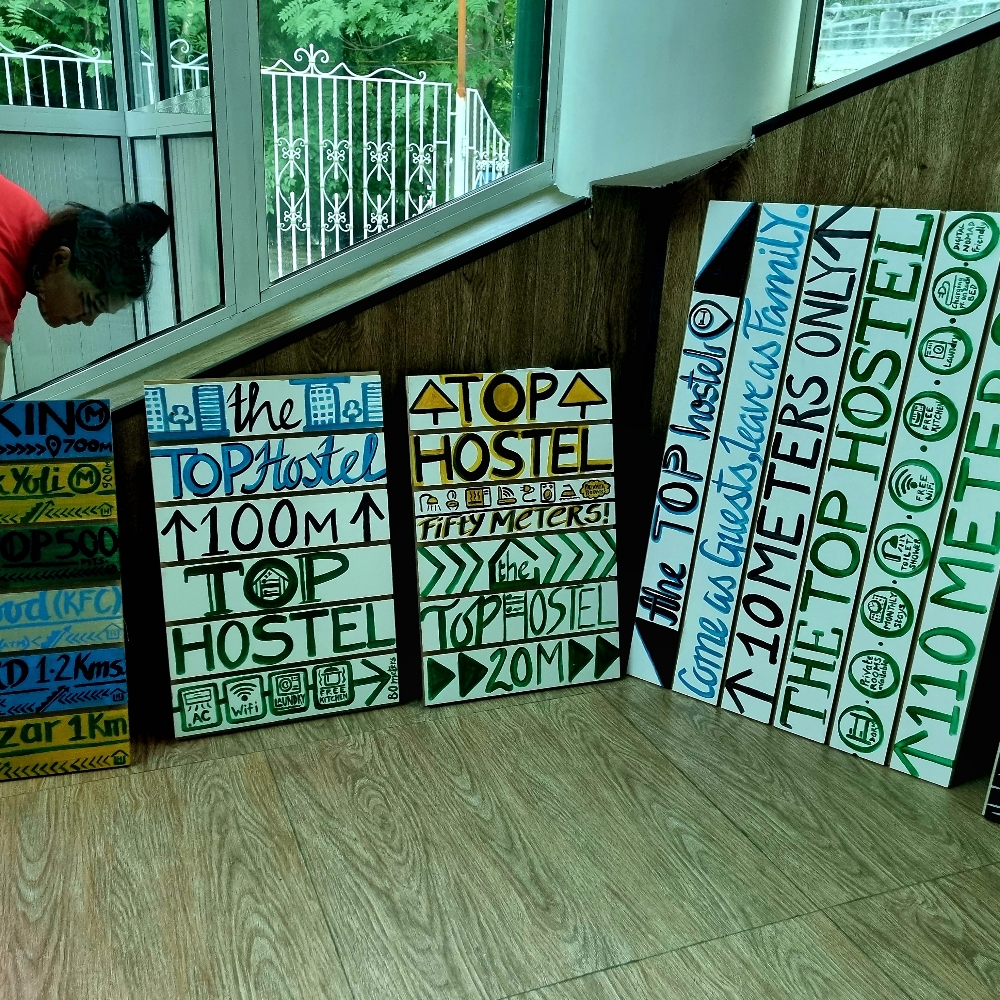 Hand painted direction boards by Vanita in Ooty